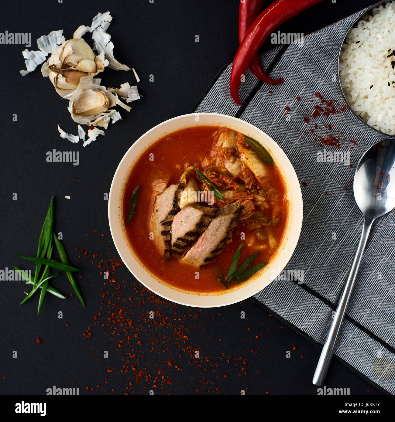 Korean cuisine. Kimchi soup on black background Stock Photo - Alamy