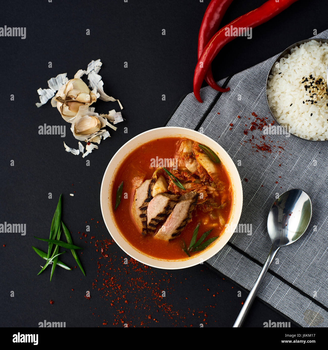 Korean cuisine. Kimchi soup on black background Stock Photo - Alamy