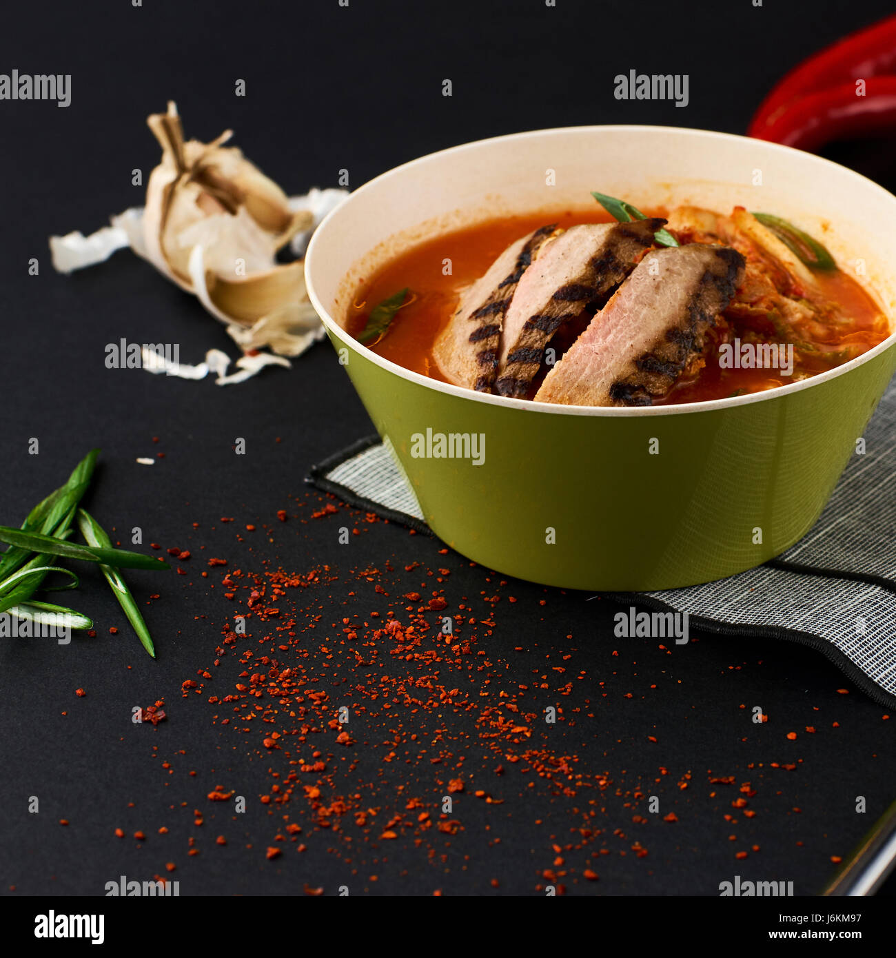 Korean cuisine. Kimchi soup on black background Stock Photo - Alamy