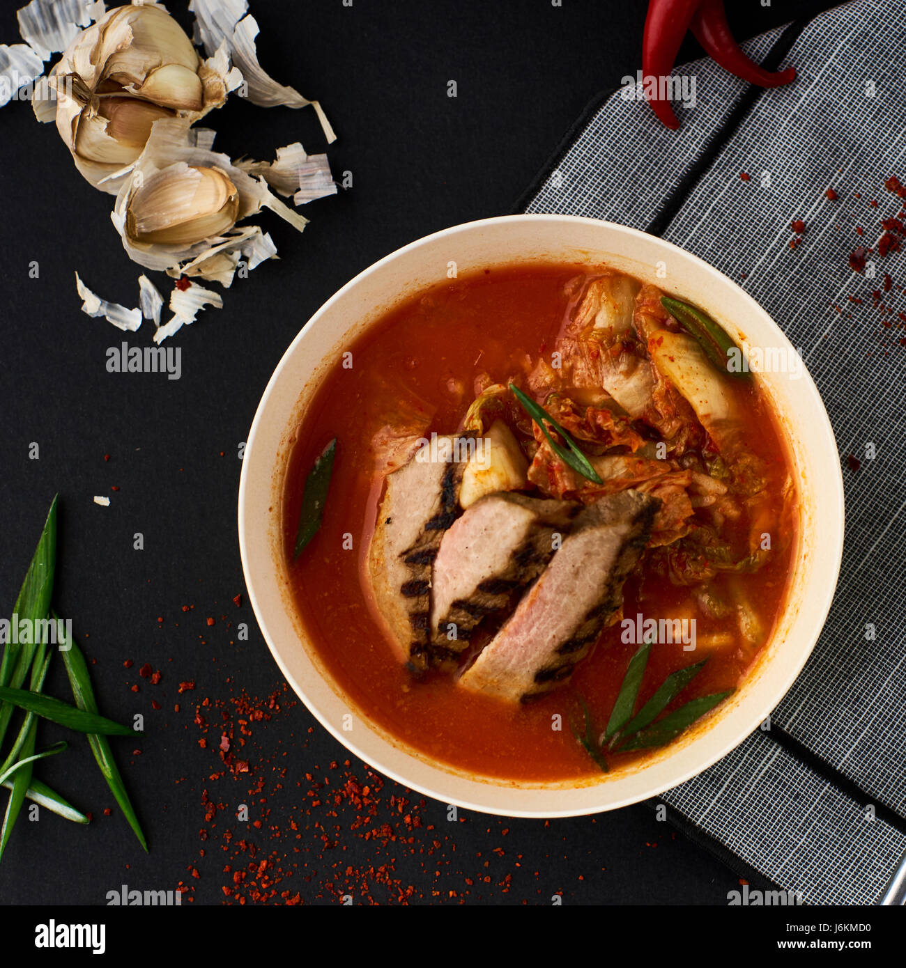 Korean cuisine. Kimchi soup on black background Stock Photo - Alamy