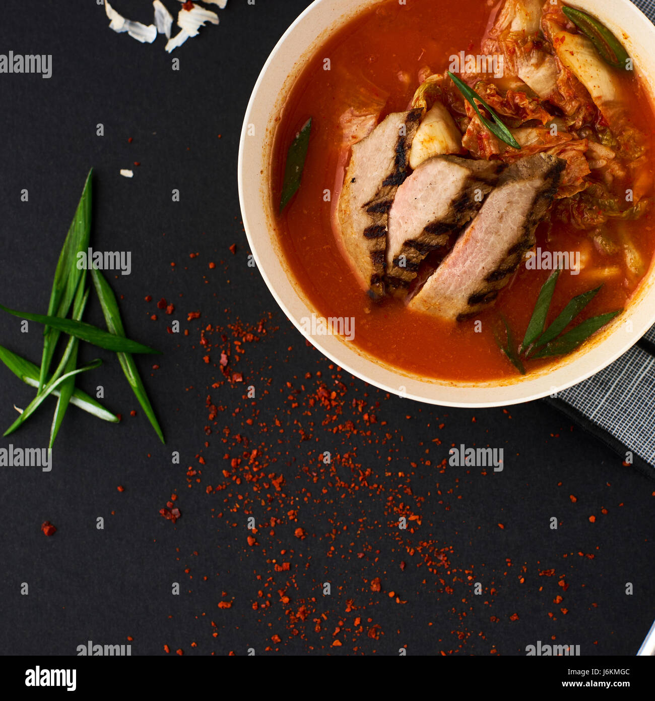 Korean cuisine. Kimchi soup on black background Stock Photo - Alamy