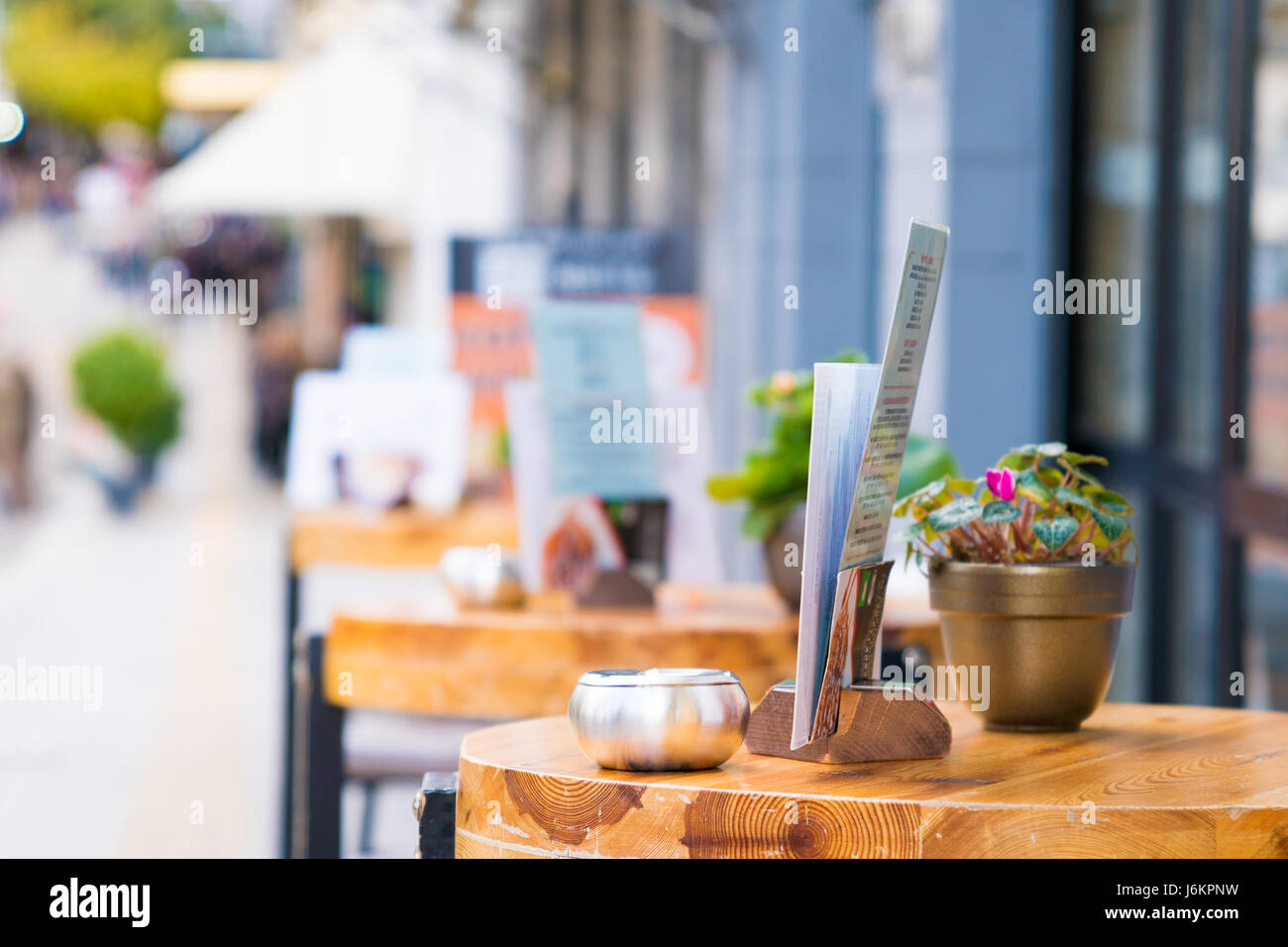 Cafe table in street Stock Photo - Alamy