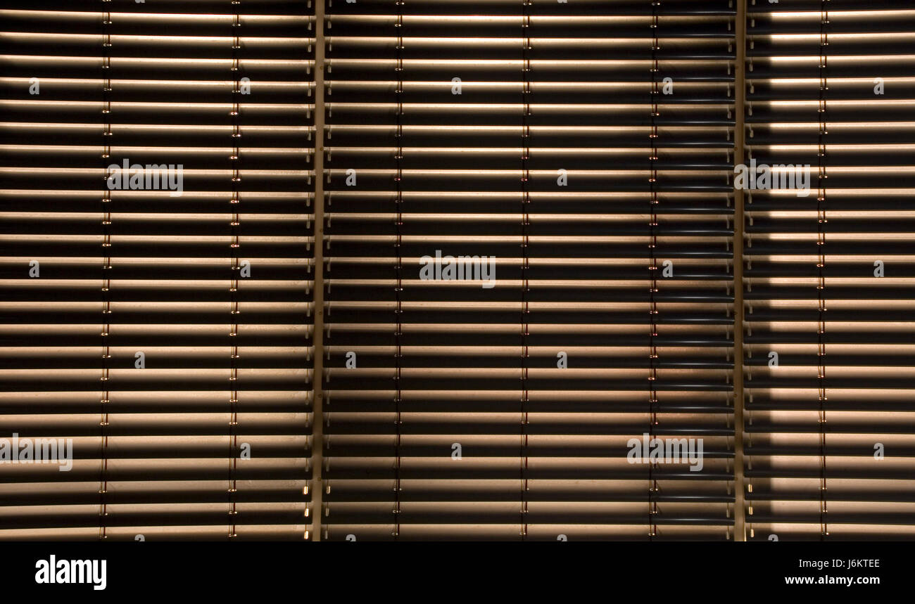 window porthole dormer window pane at night lighted sun-blind shutter ...