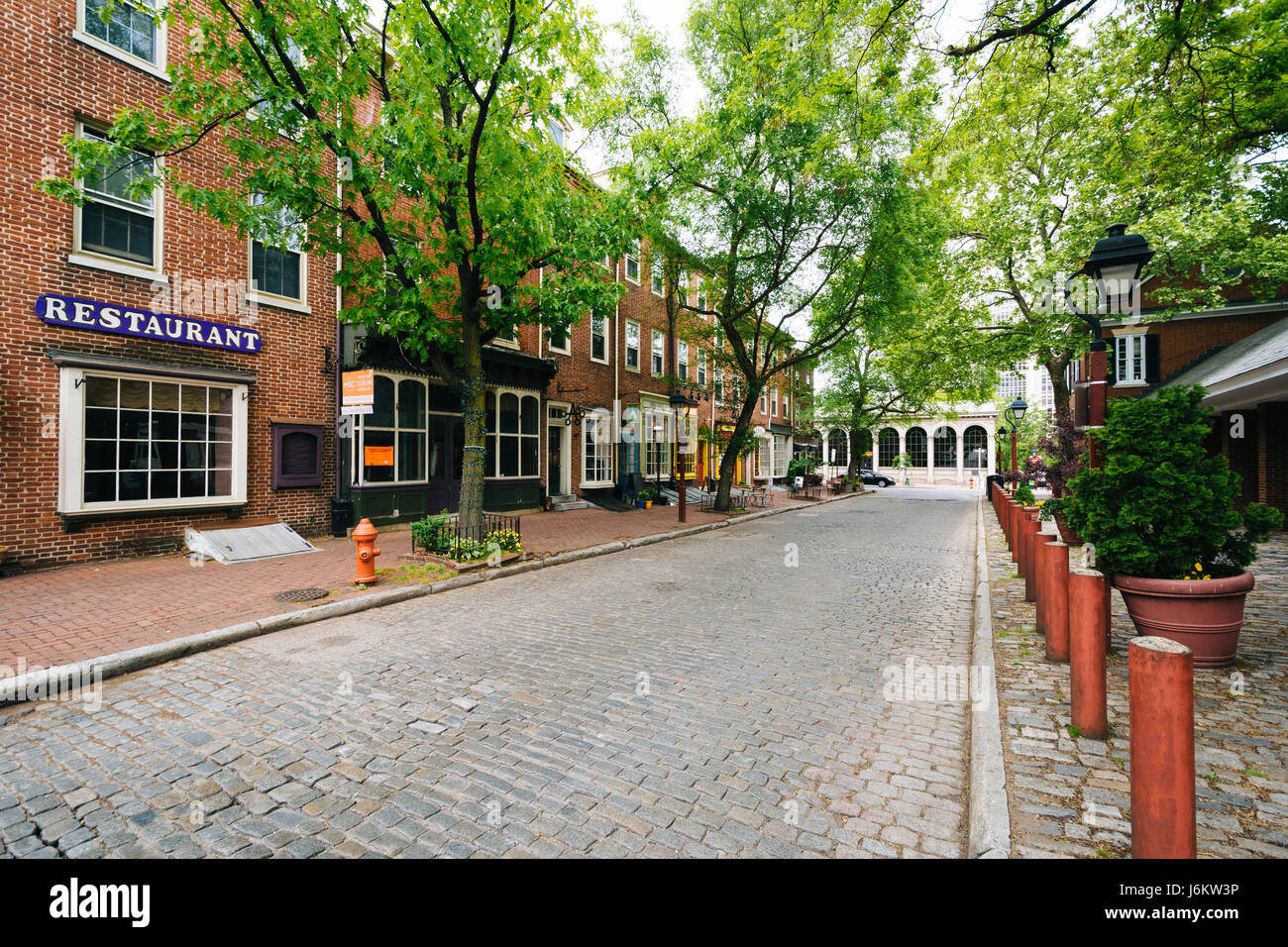 Brick buildings and cobblestone street at Head House Square, in Society ...