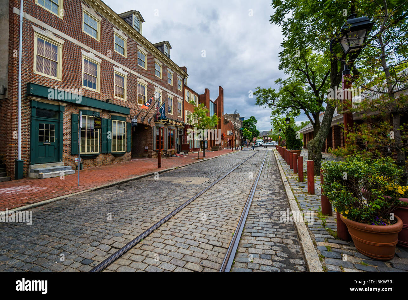 Brick buildings and cobblestone street at Head House Square, in Society ...