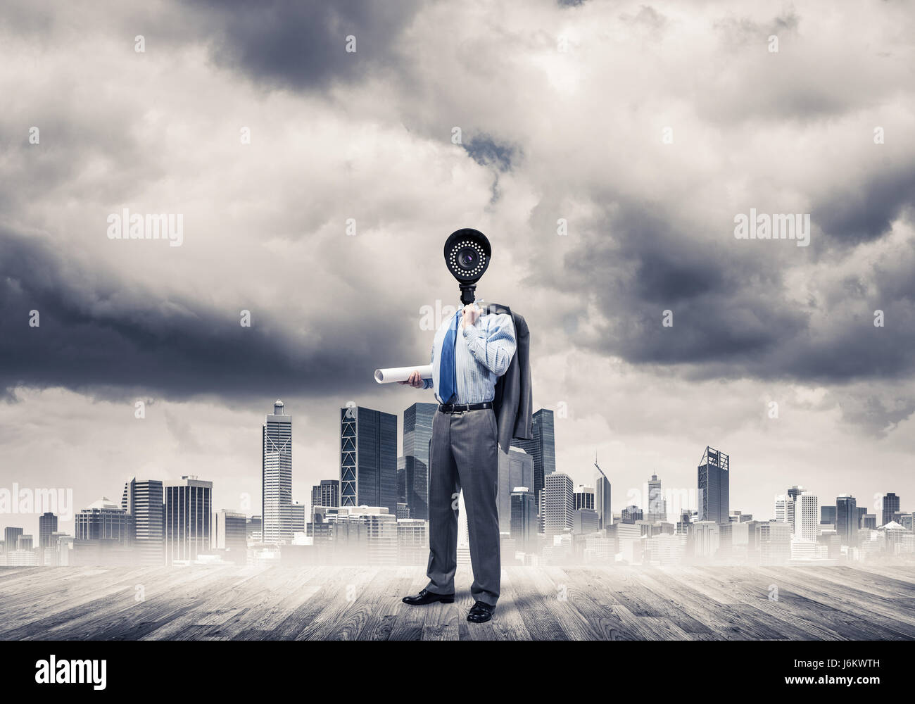 Camera headed man standing on wooden floor against modern citysc Stock ...