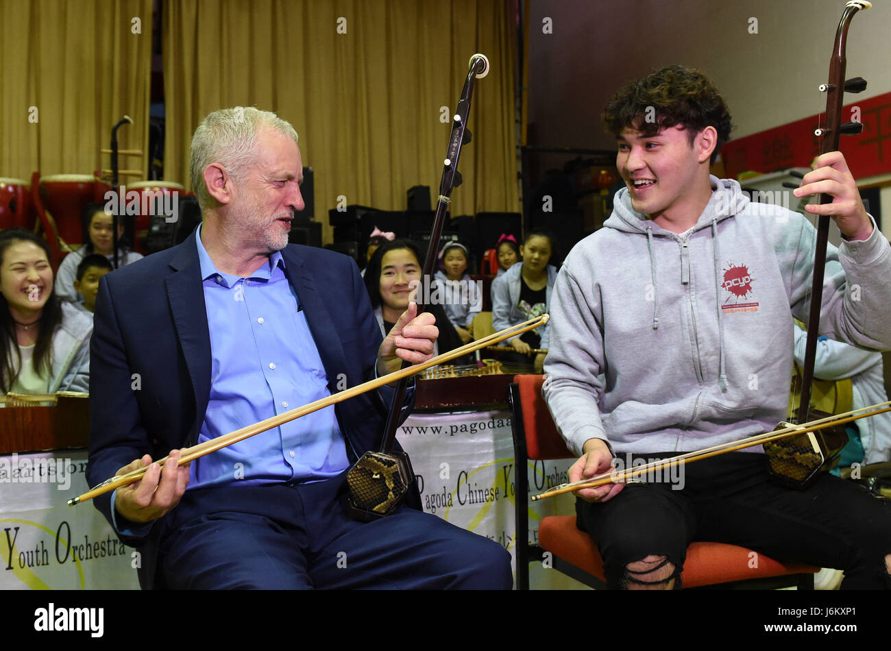 Labour leader Jeremy Corbyn (left) with Charlie Wardle, 17, playing an ...