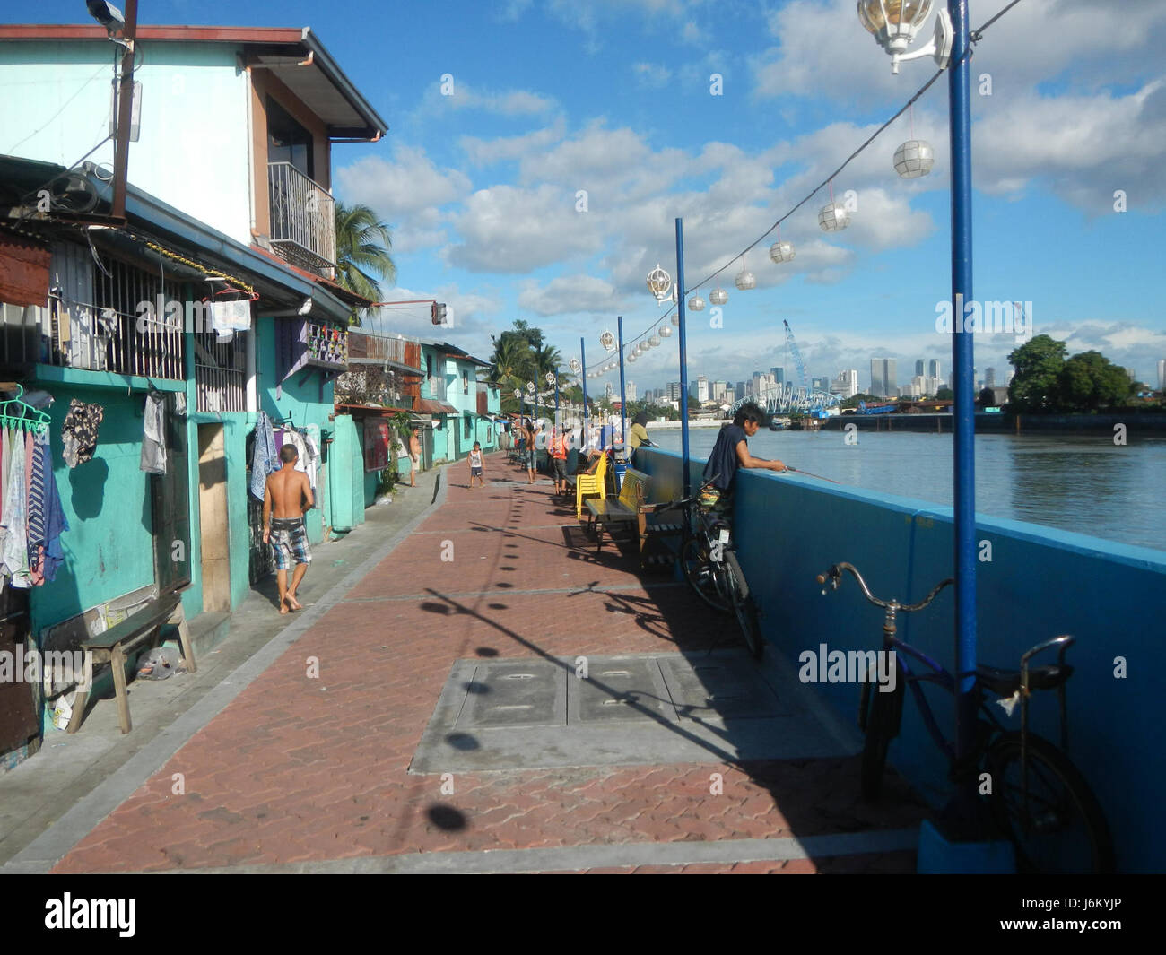 This photograph captures the linear park located along the Pasig River ...