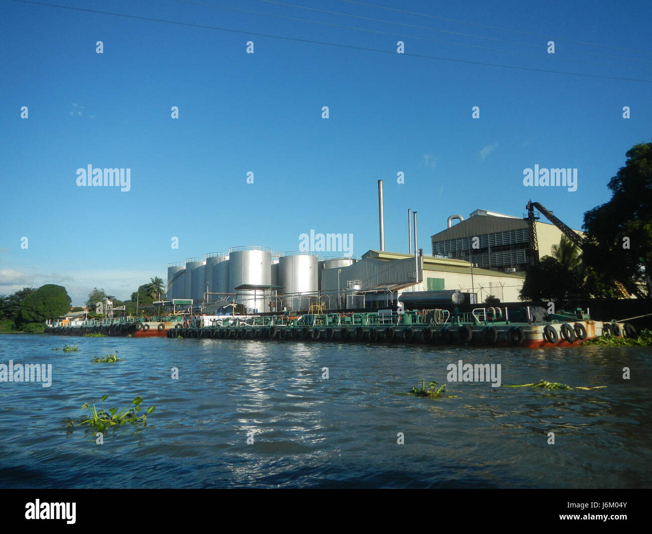 The image shows a view of the Pasig River in Manila, Philippines ...