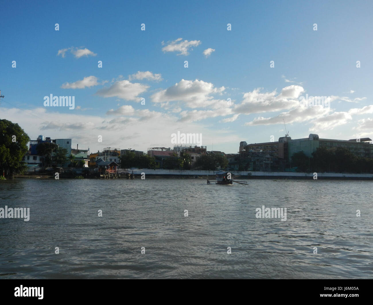 This image highlights the Pasig River flowing through the areas of ...