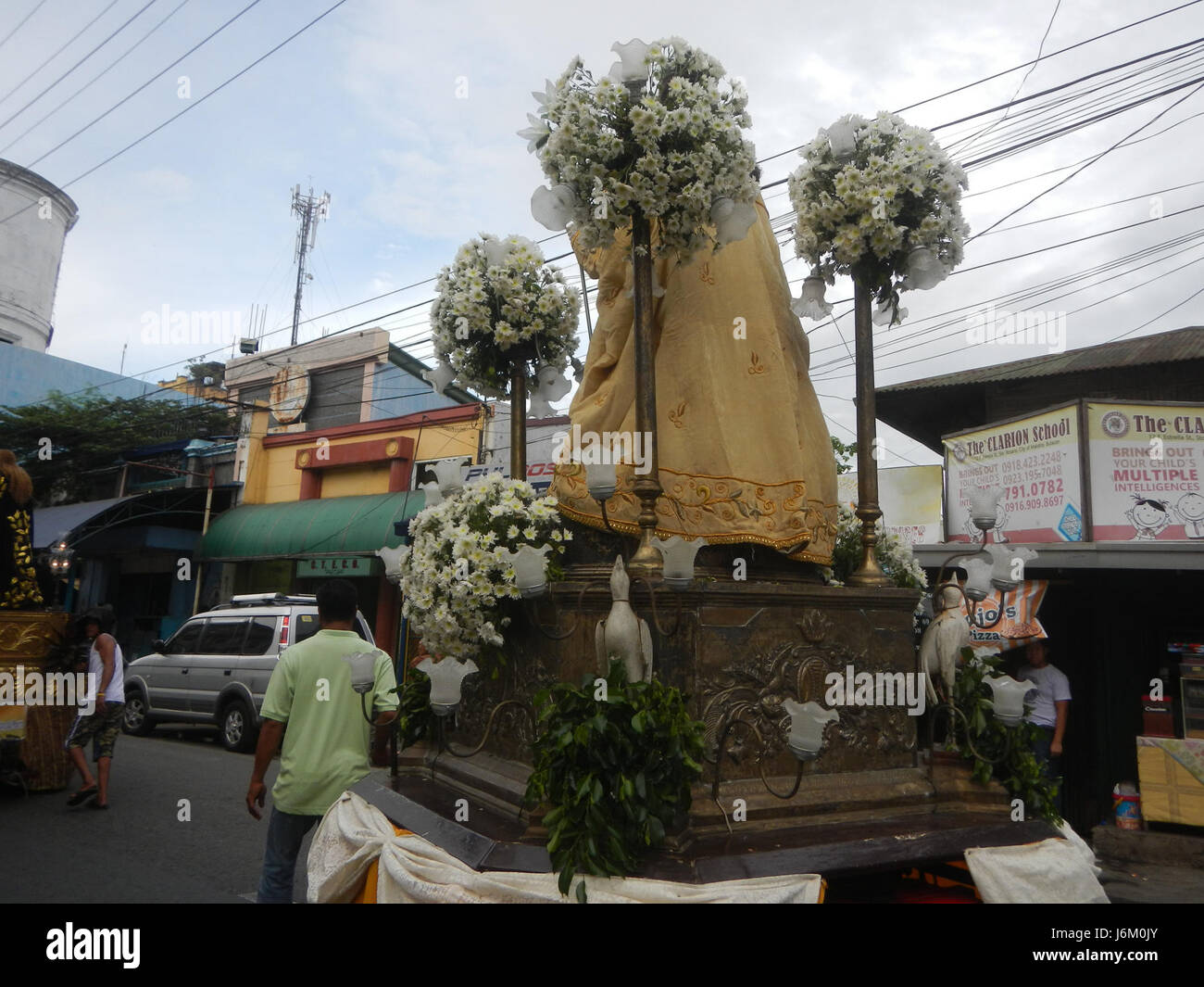 The image shows a procession from the 'Pistang Bayan' event on December ...