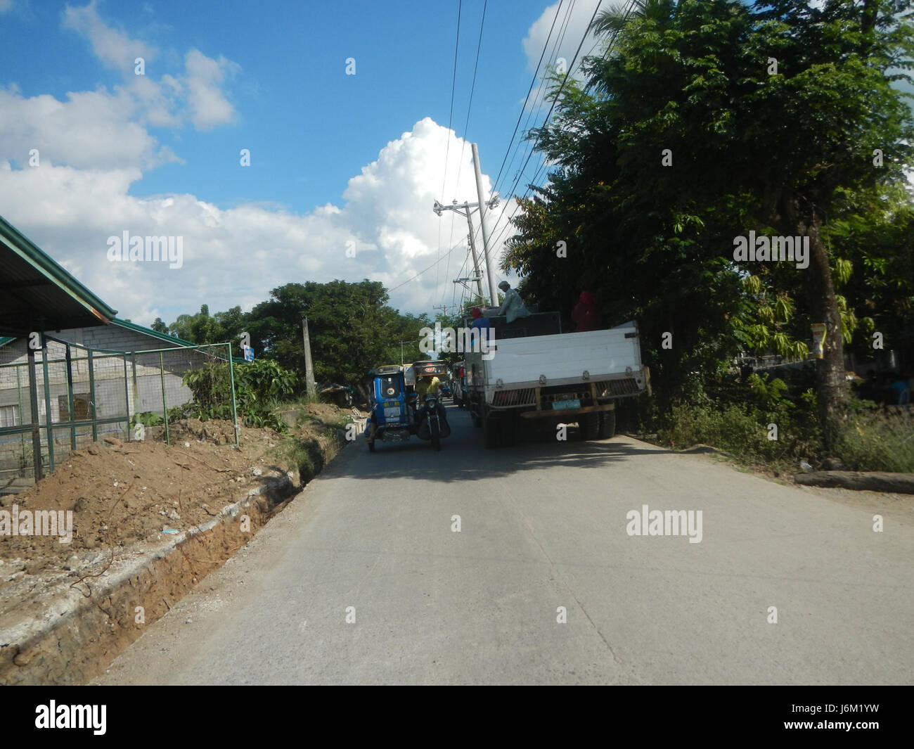 This image shows a rural road in San Vicente Agustin, Batasan Bata ...