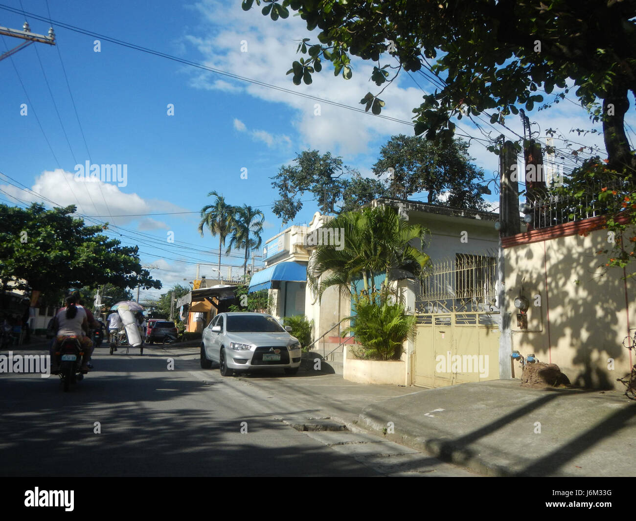 This image depicts a rural road in the Bulacan province of the ...