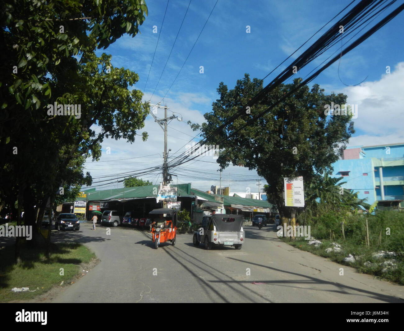The image captures a rural road in Ibayo Poblacion, Marilao, Bulacan ...