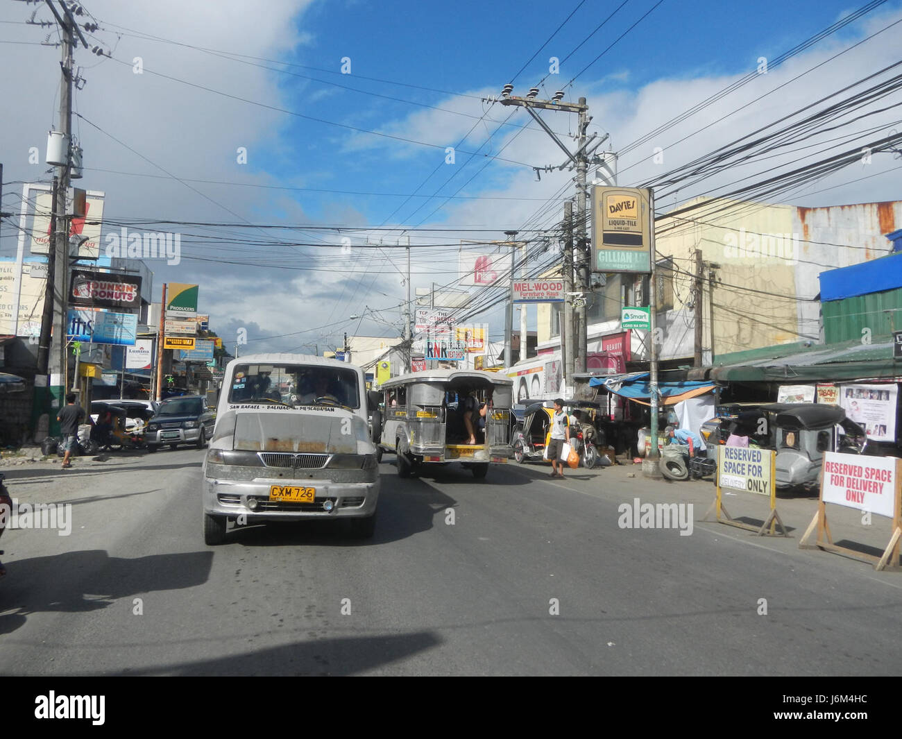 This image depicts the Maharlika Highway, Road 1463, passing through ...