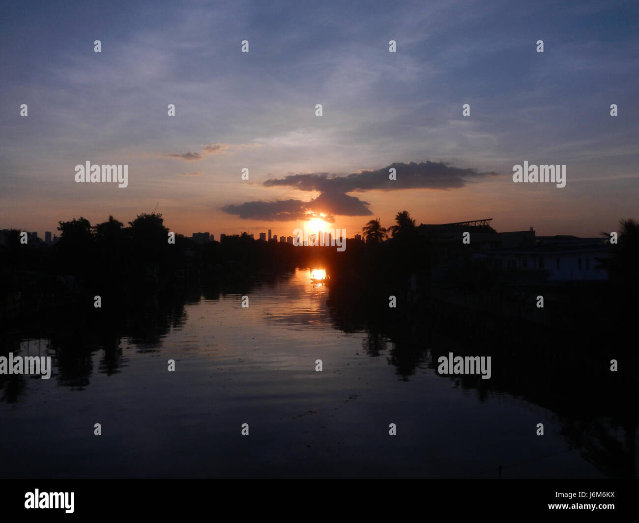 This photograph captures a sunset view from Kalentong in Santa Ana ...