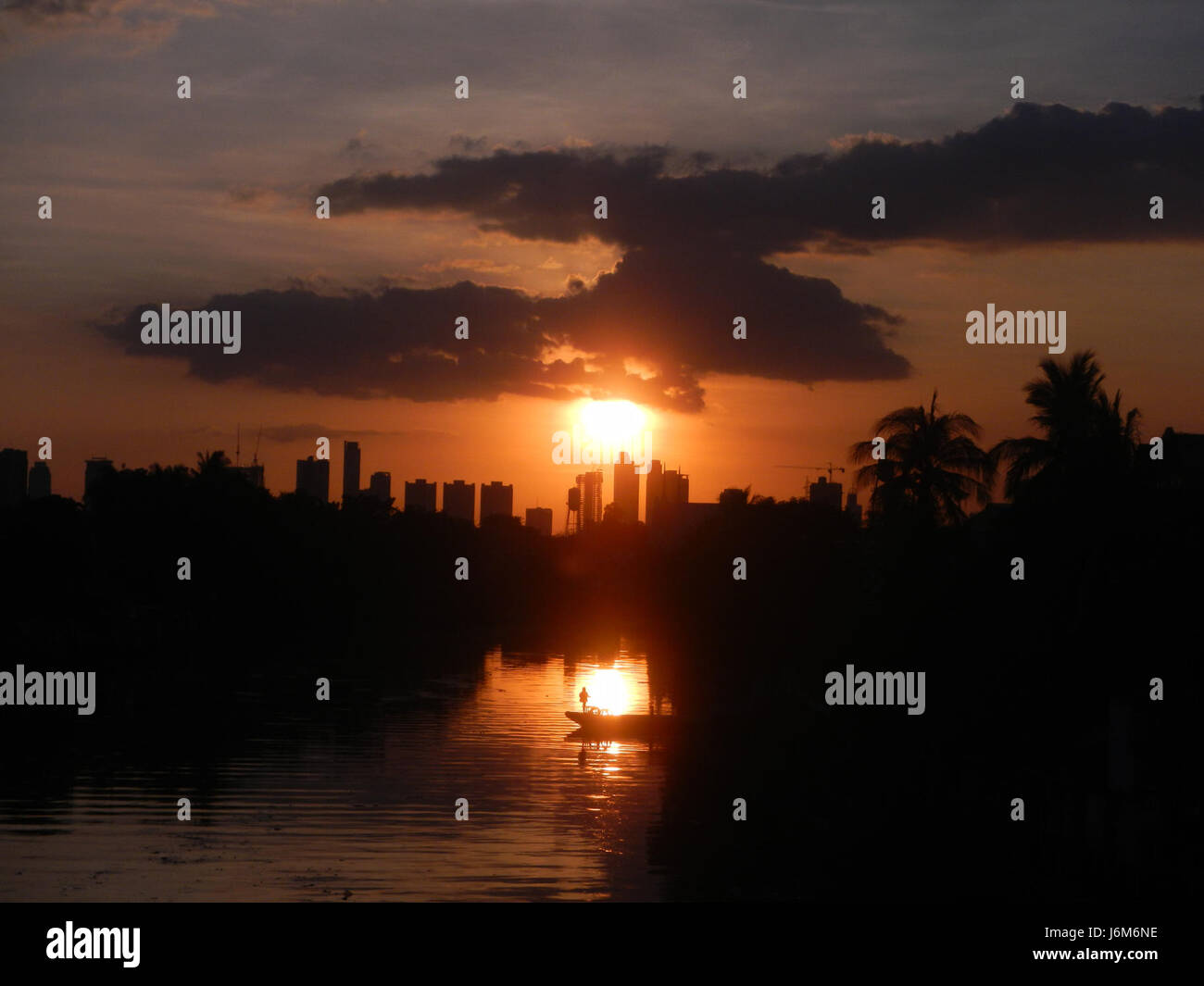 This image shows the stunning sunset over Kalentong, Santa Ana, and ...