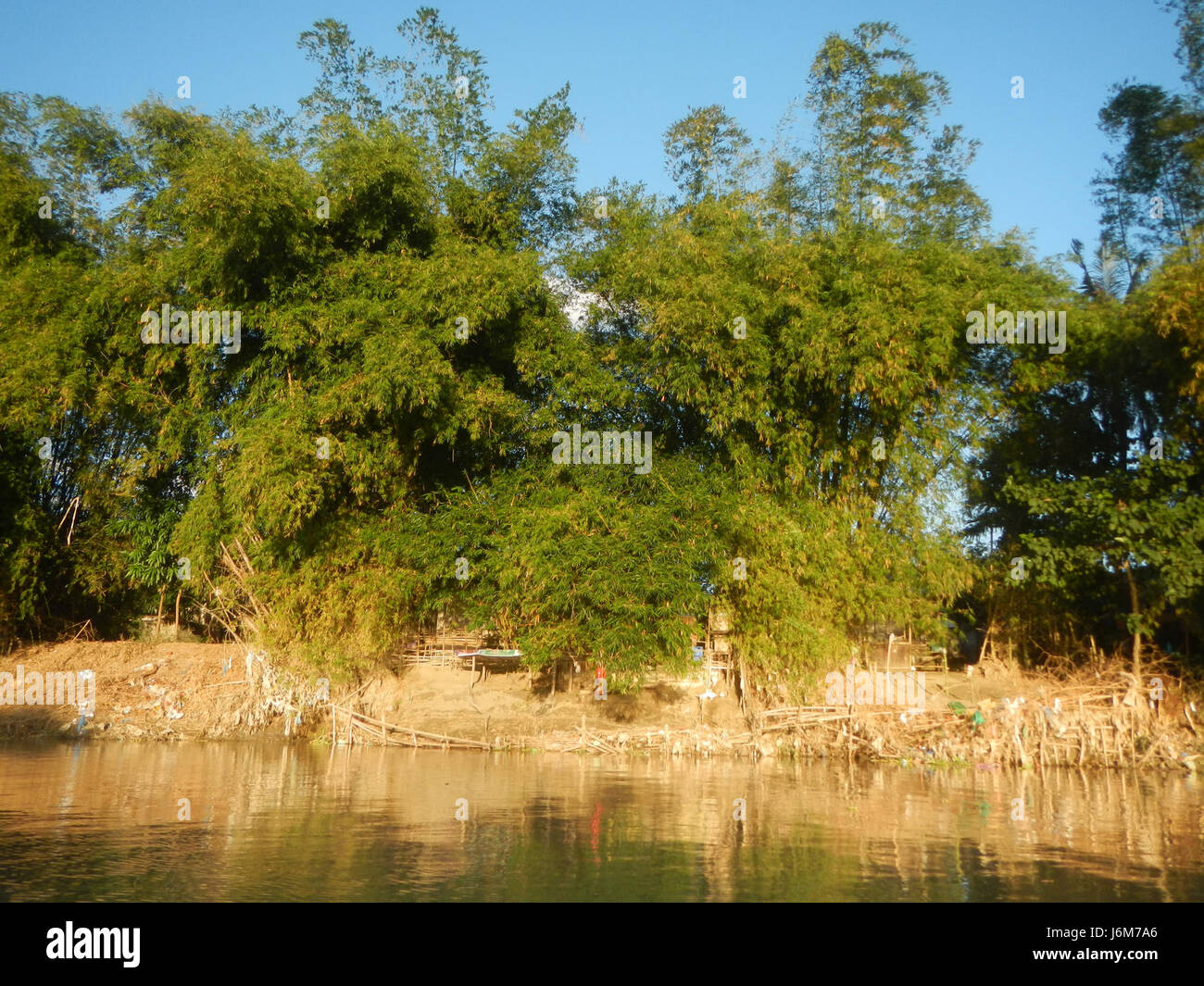 This image shows the riverbanks of Cansinala, located in Apalit ...