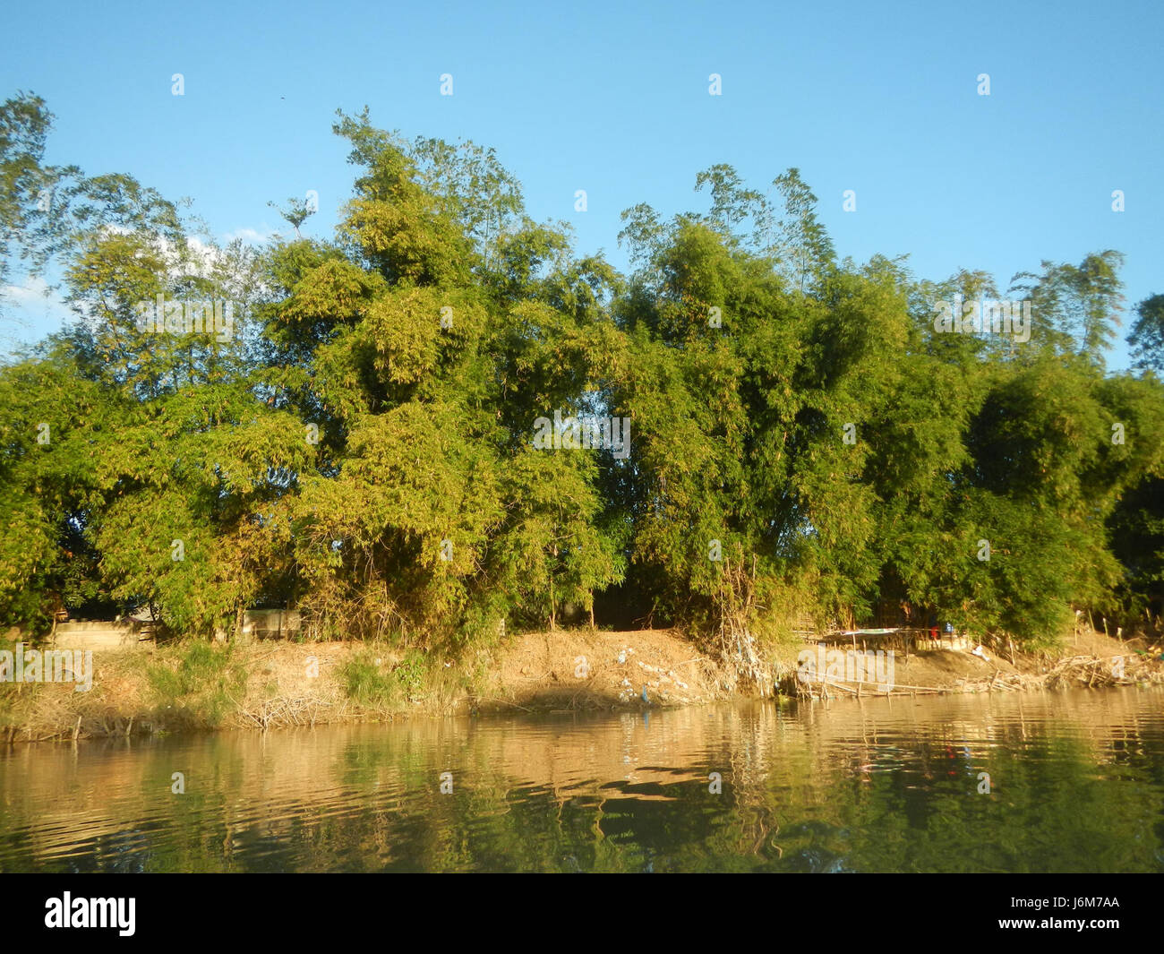 This image depicts the riverbanks of Cansinala in Apalit, Pampanga ...