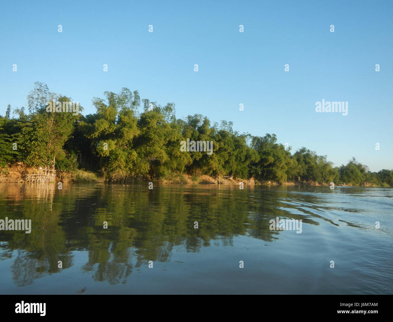This photograph captures the riverbanks of Cansinala in Apalit ...