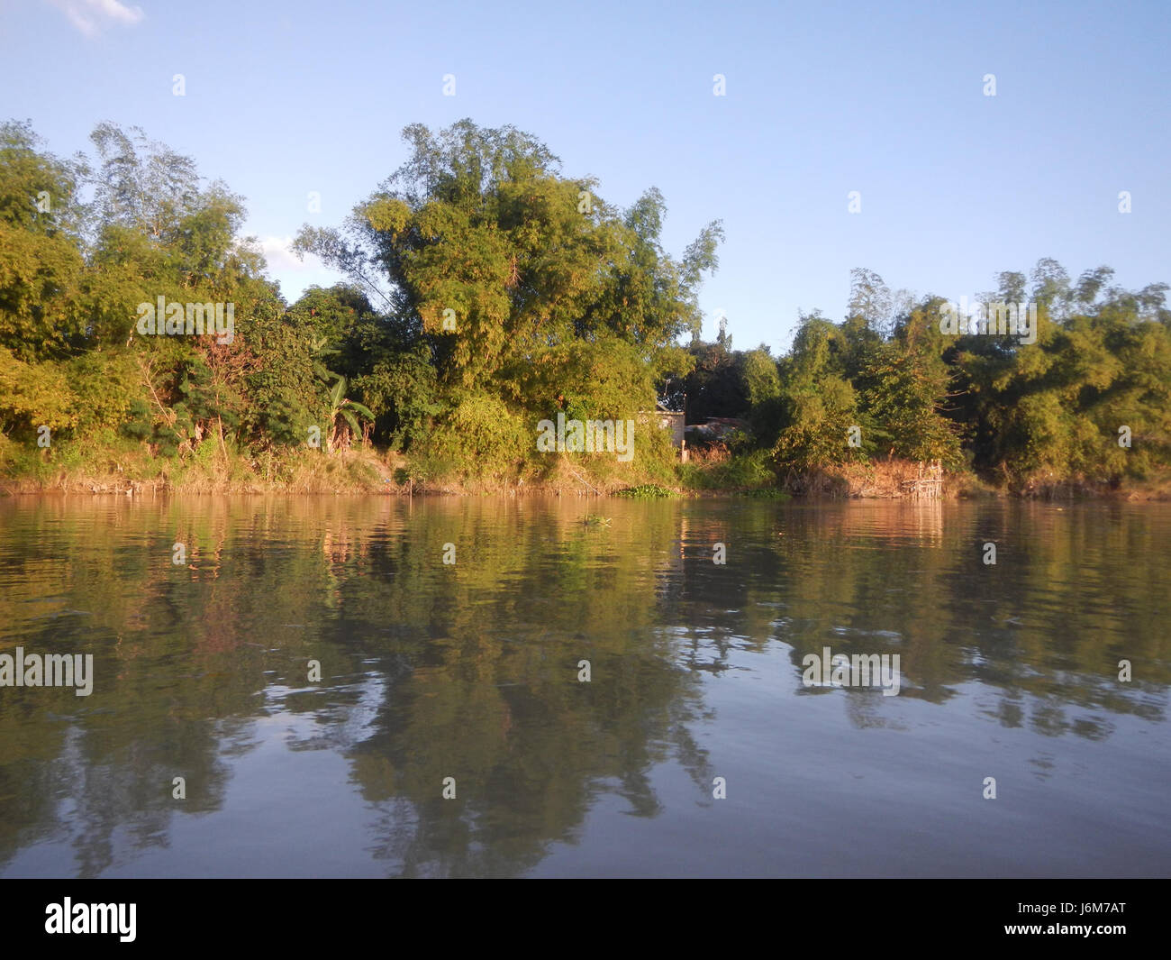 This image depicts the riverbanks of Cansinala in Apalit, Pampanga ...