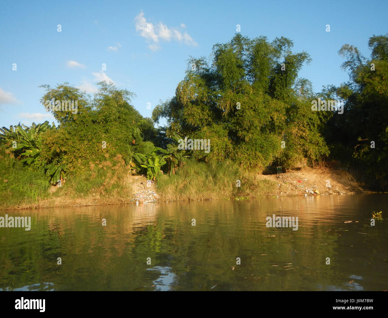 A photograph depicting the riverbanks of Cansinala, Apalit, Pampanga ...