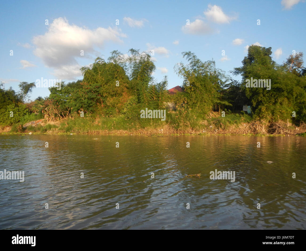 The riverbanks of Cansinala, Apalit, and the San Miguel Bridge near San ...
