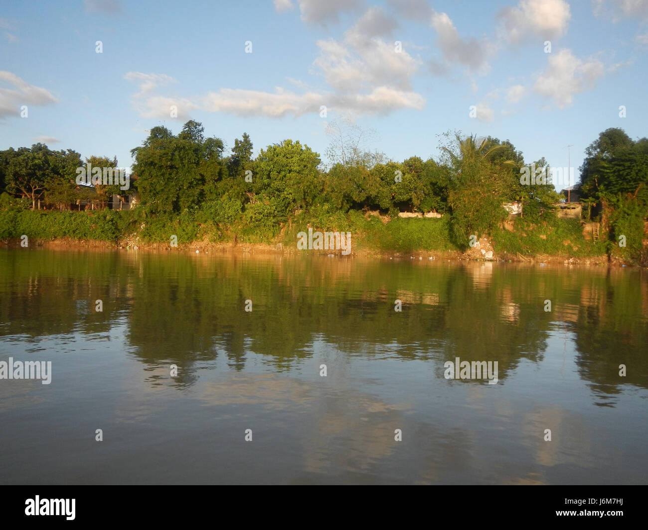 This image depicts the riverbanks of the Pampanga River near the San ...