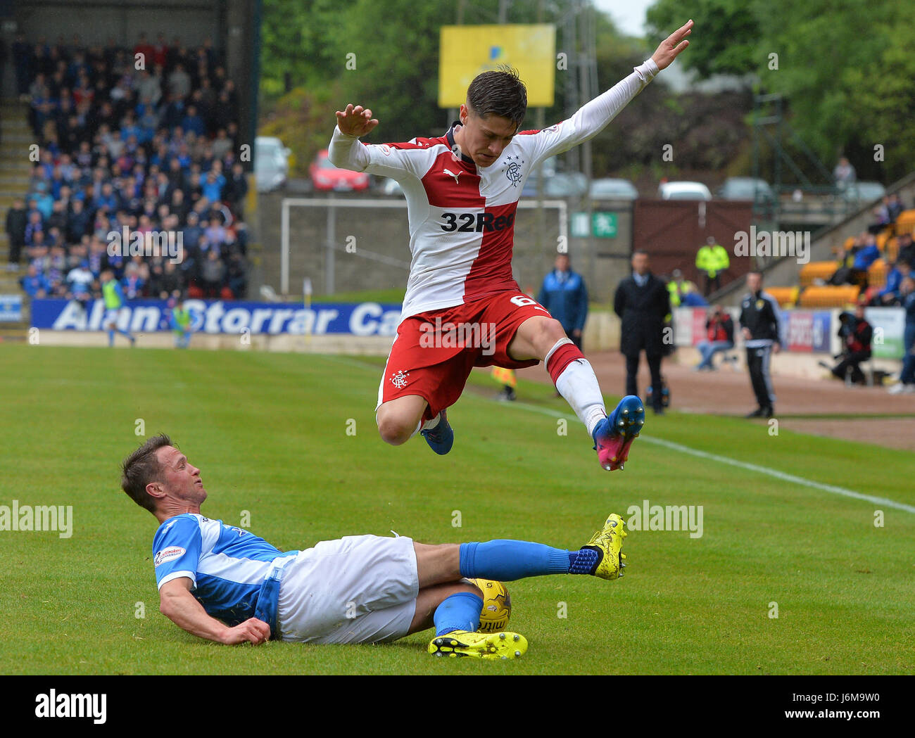 Myles Beerman of Rangers is tackled by Chris Millar of St Johnstone ...