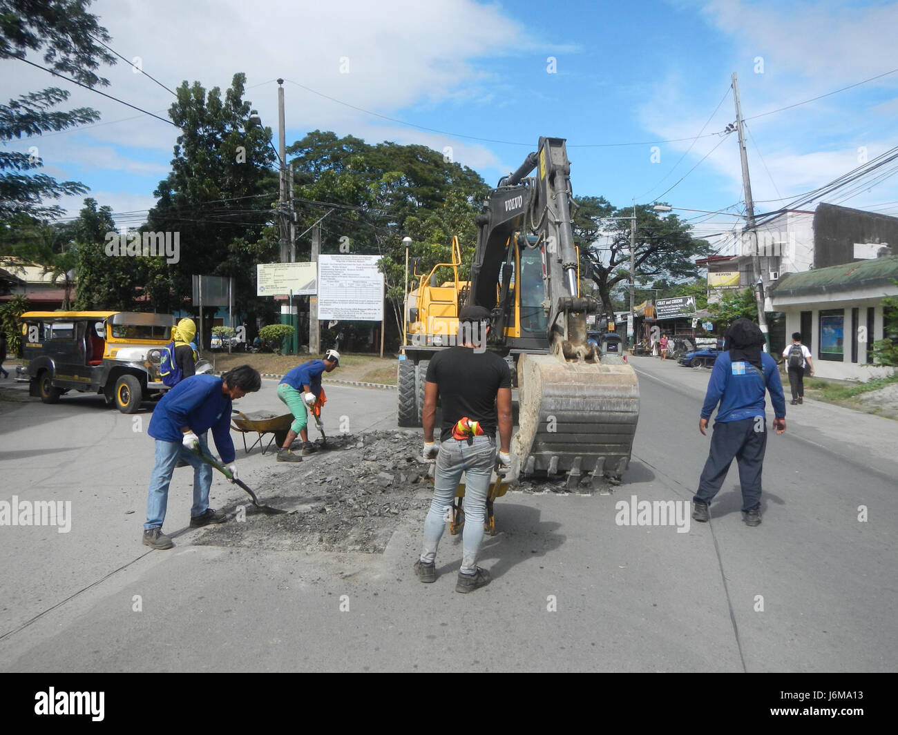 This image shows road construction activities on the Maharlika Highway ...