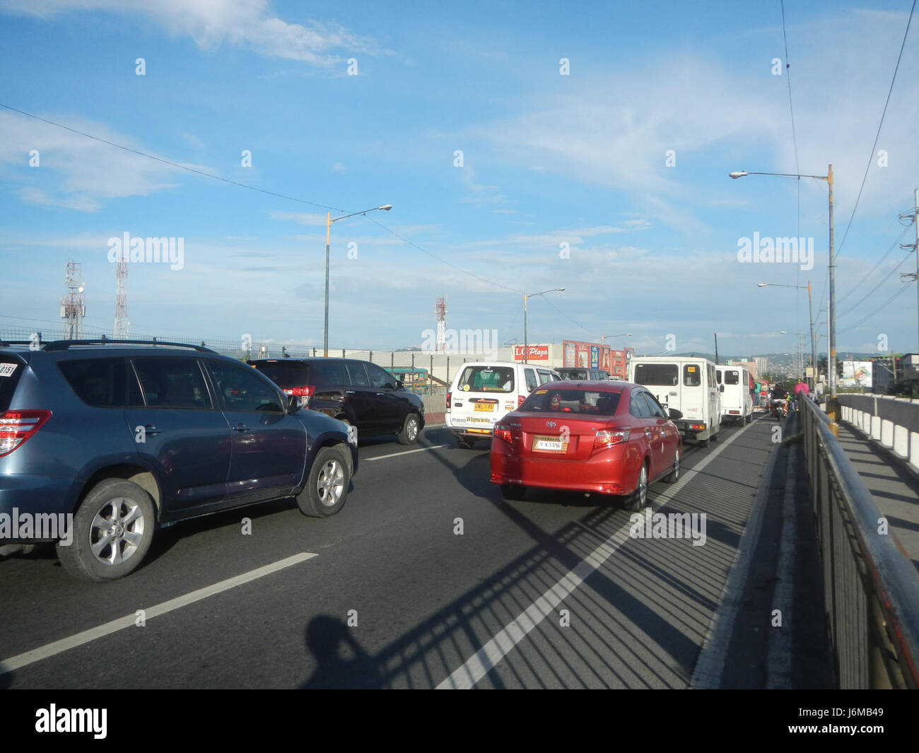 This image shows the Ortigas Avenue Extension Bridge and its overpasses ...