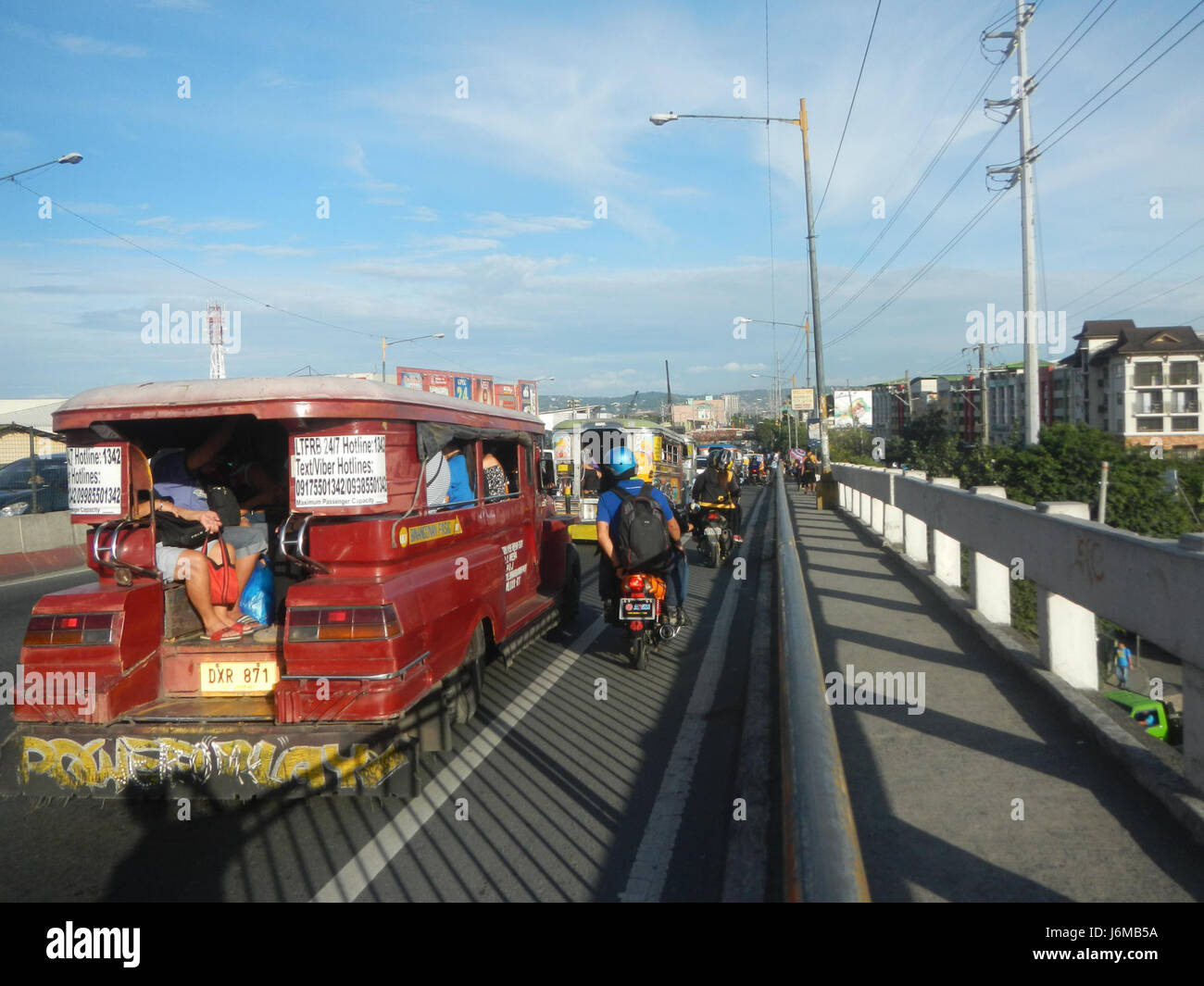 This image shows the Ortigas Avenue Extension Bridge in Pasig City ...