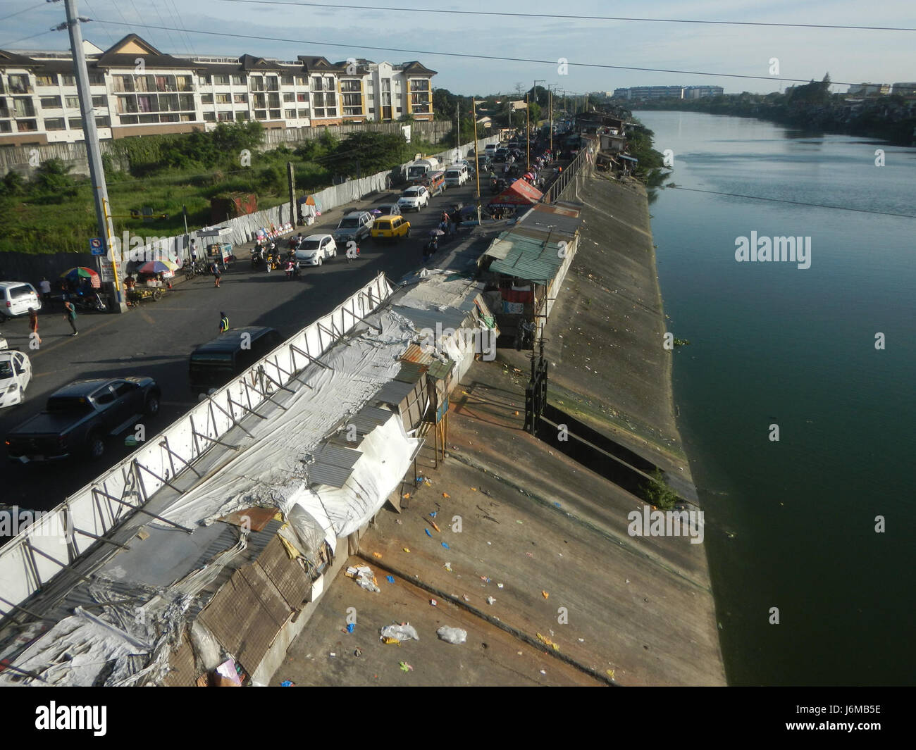 The Ortigas Avenue Extension Bridge in Pasig City spans over the river ...