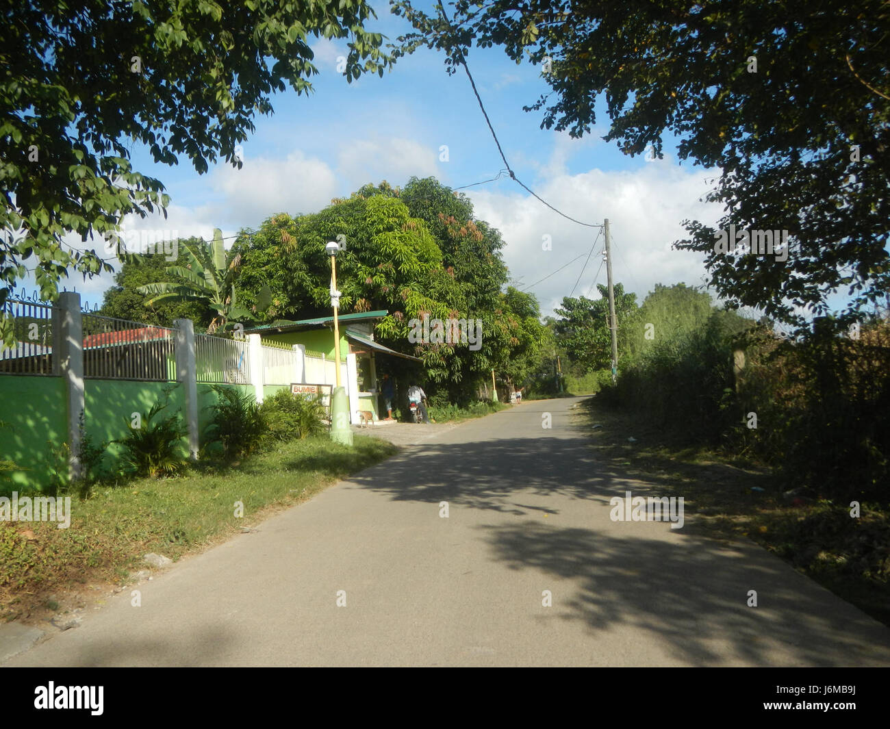 This image shows a road in the Bulacan province of the Philippines ...