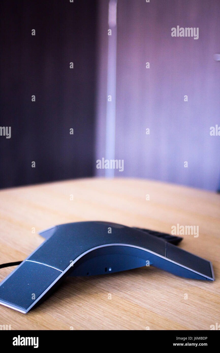 Conference call speaker telephone in luxury modern office table ...