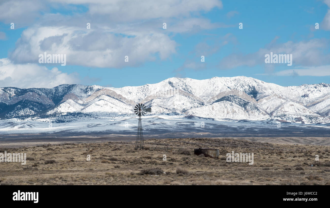 Windmill and Water Tank in Eastern Utah Stock Photo - Alamy