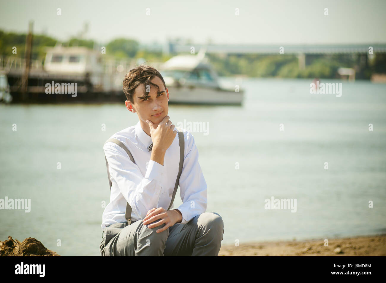 young skinny man, elegantly stylishly dressed in white shirt, gray ...