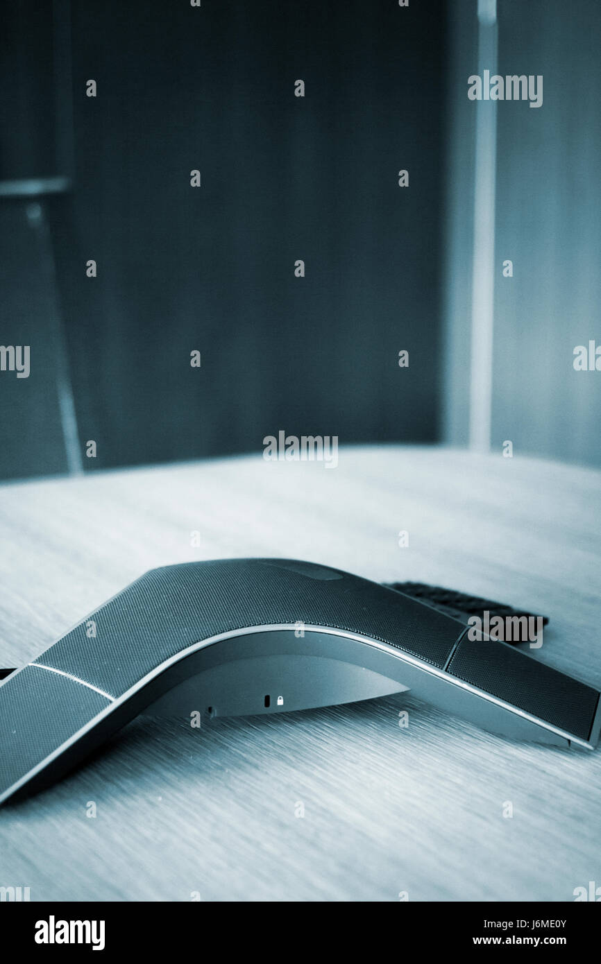 Conference call speaker telephone in luxury modern office table ...