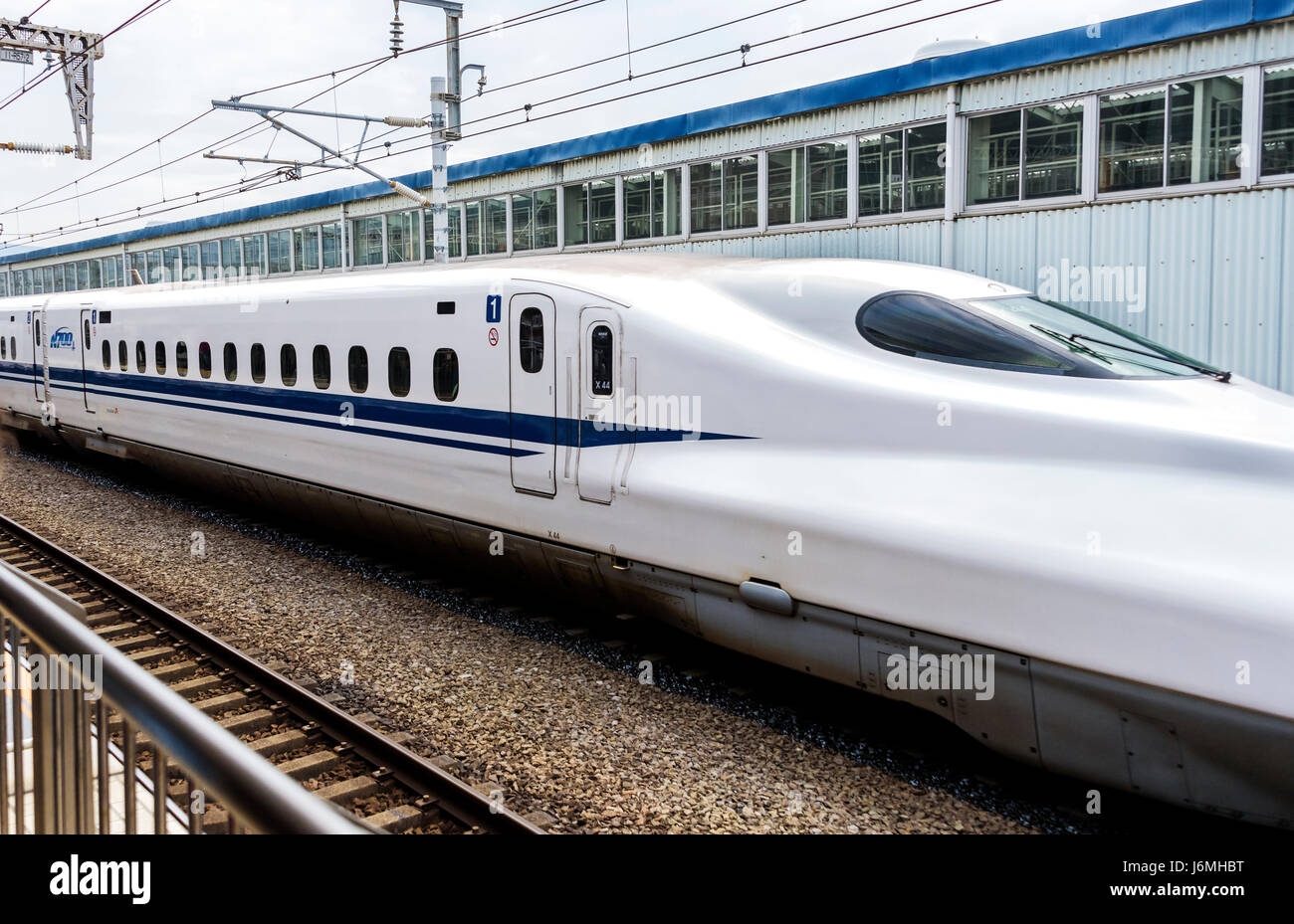 Shinkansen, bullet train speeding through Mishima station, on the J R ...