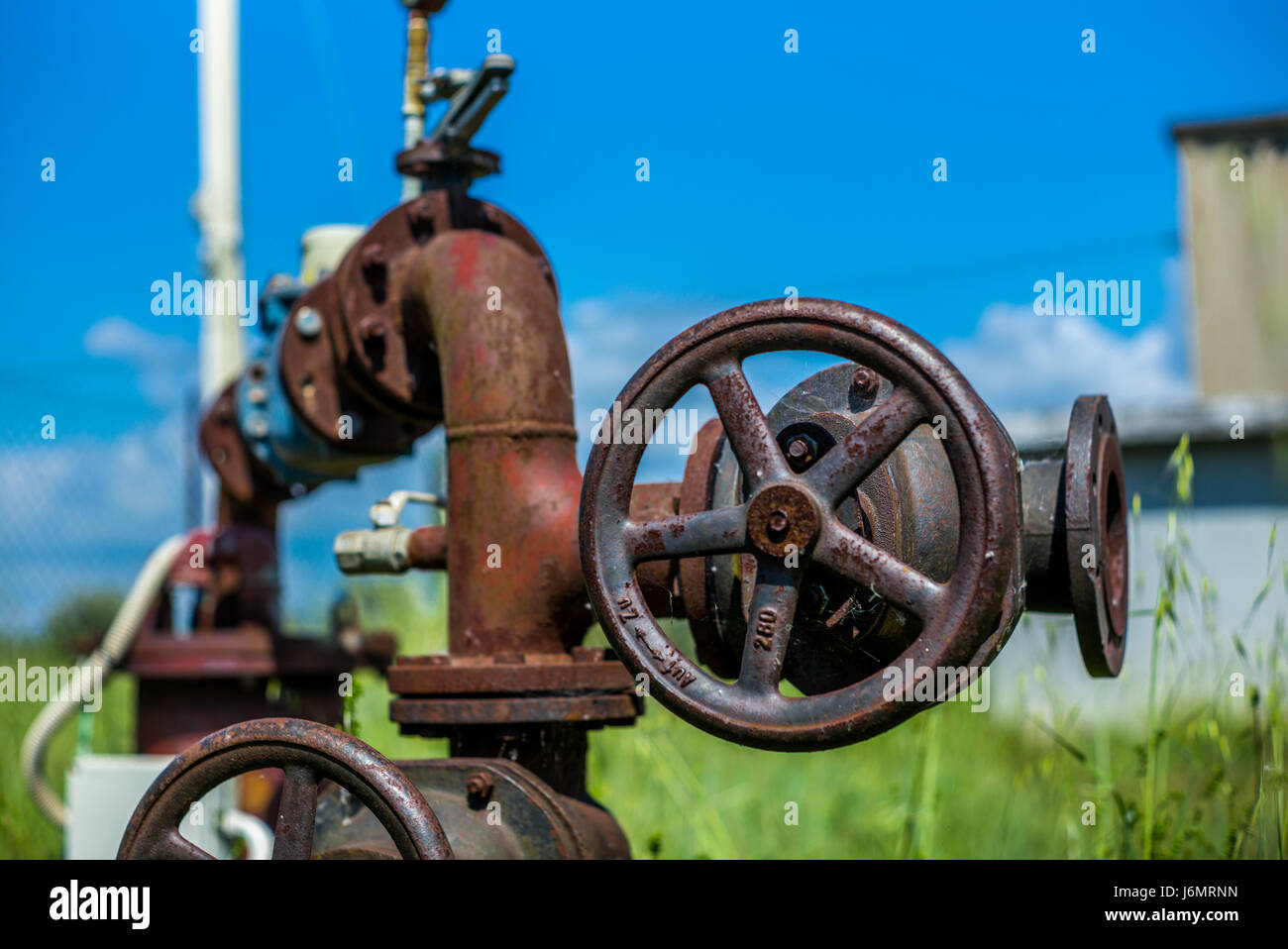 Rusty pipes, wheel and valves - 2 Stock Photo - Alamy