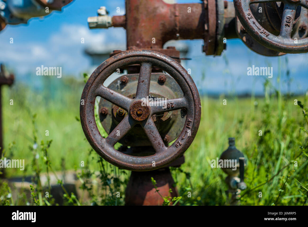 Rusty pipes, wheel and valves - 3 Stock Photo - Alamy