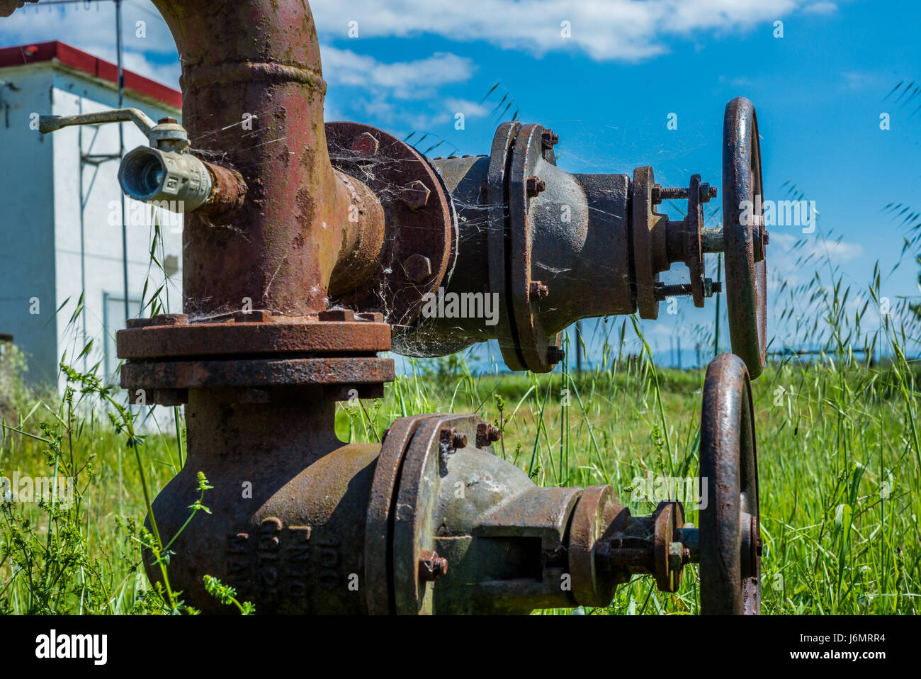 Rusty pipes, wheel and valves - 5 Stock Photo - Alamy