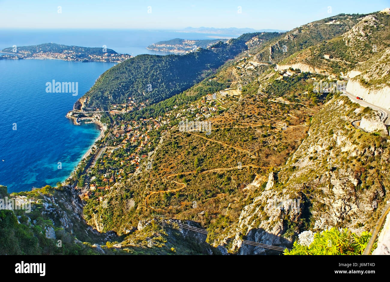 The rocky slopes of Alps are covered with poor vegetation with zigzag ...