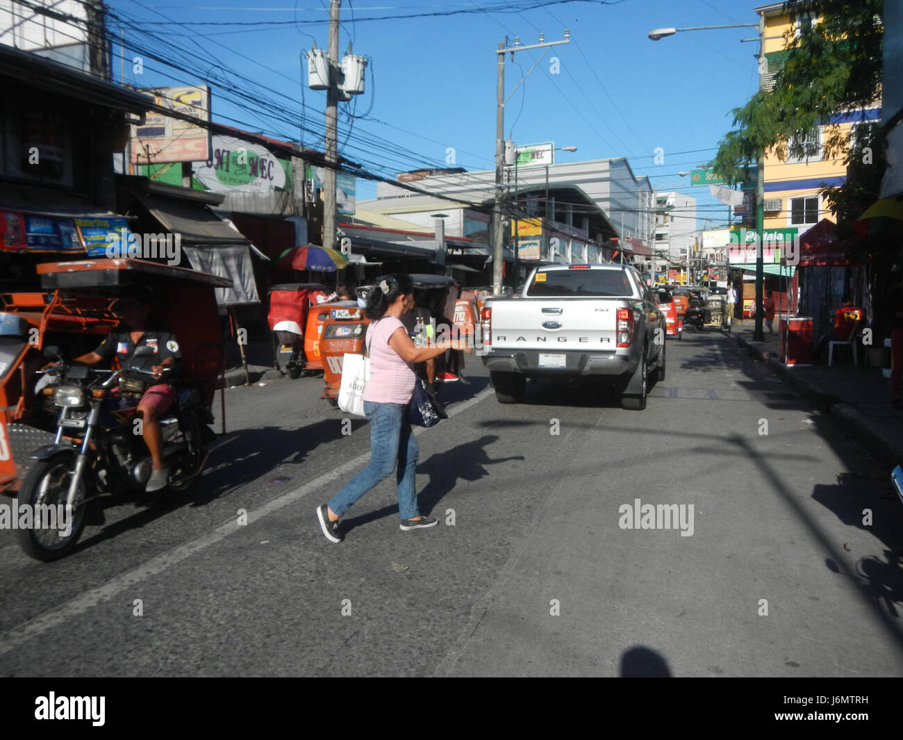 This image showcases the streets of Barangays Pembo and Comembo in ...