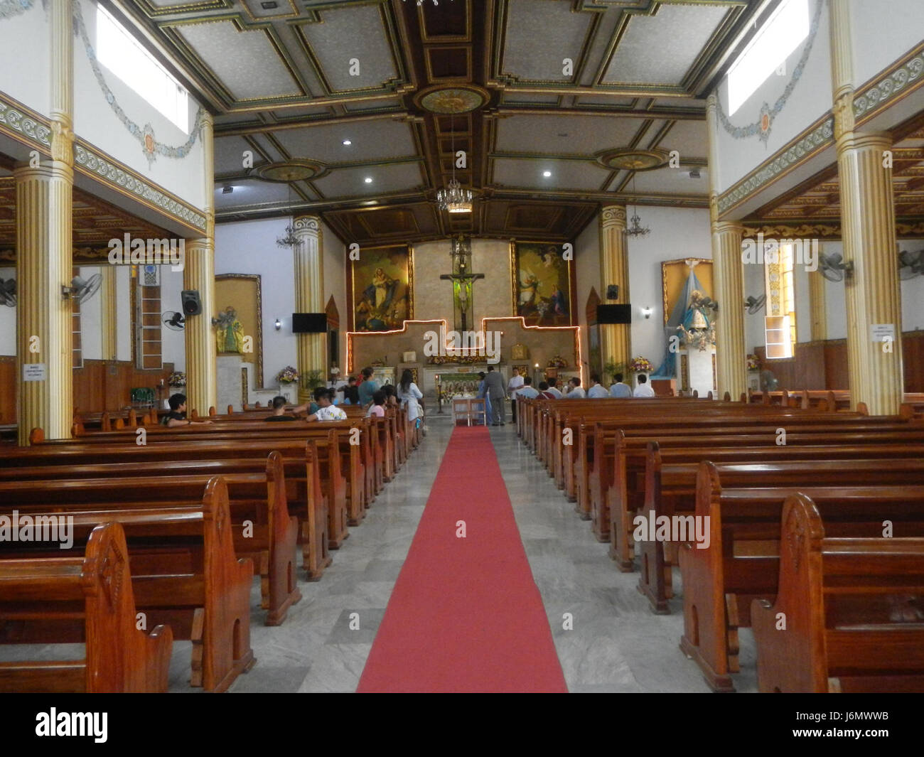 The image depicts the interior of the Immaculate Conception Parish ...