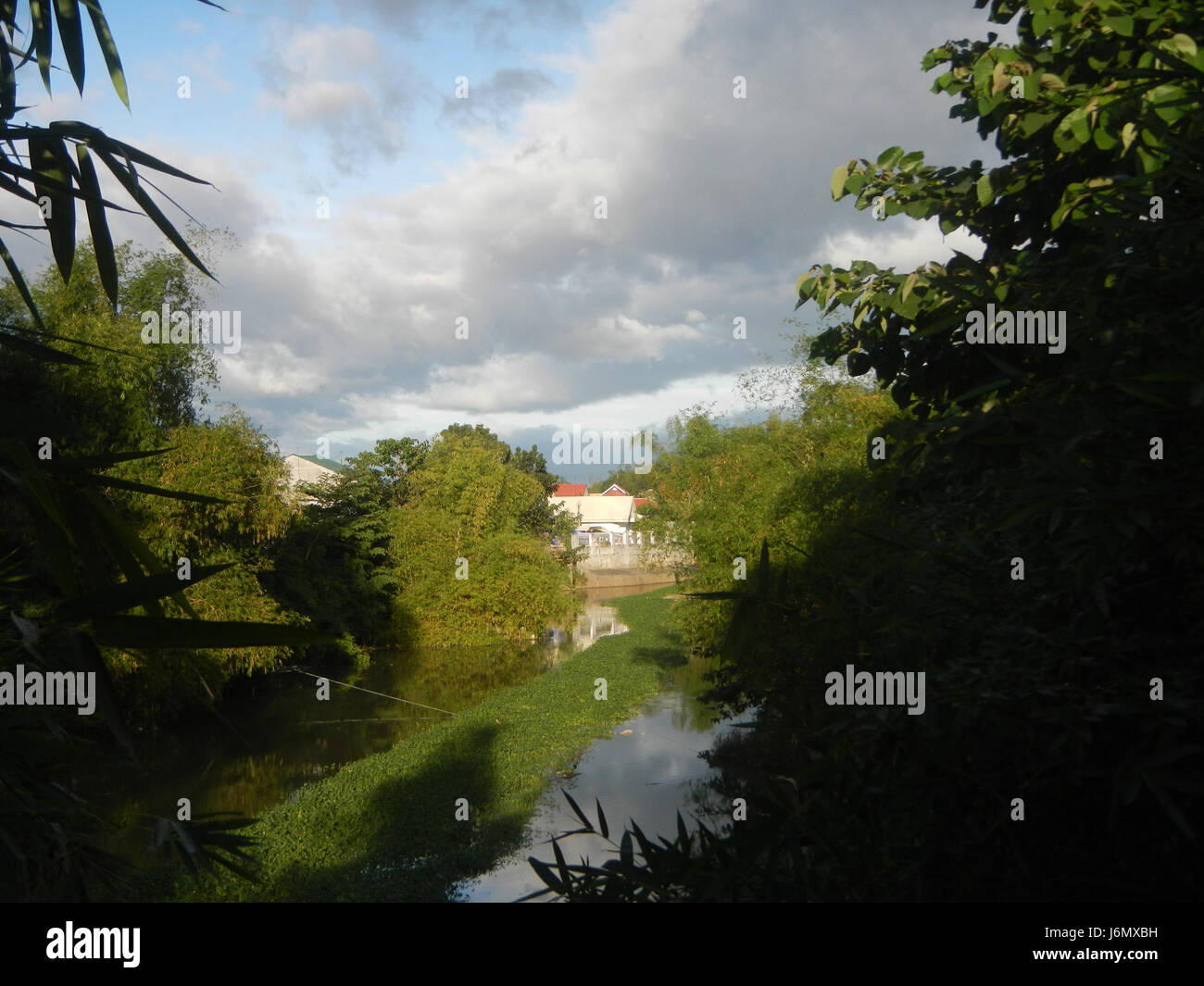 This image shows a road in Candaba, Pampanga, featuring the Bahay Pare ...