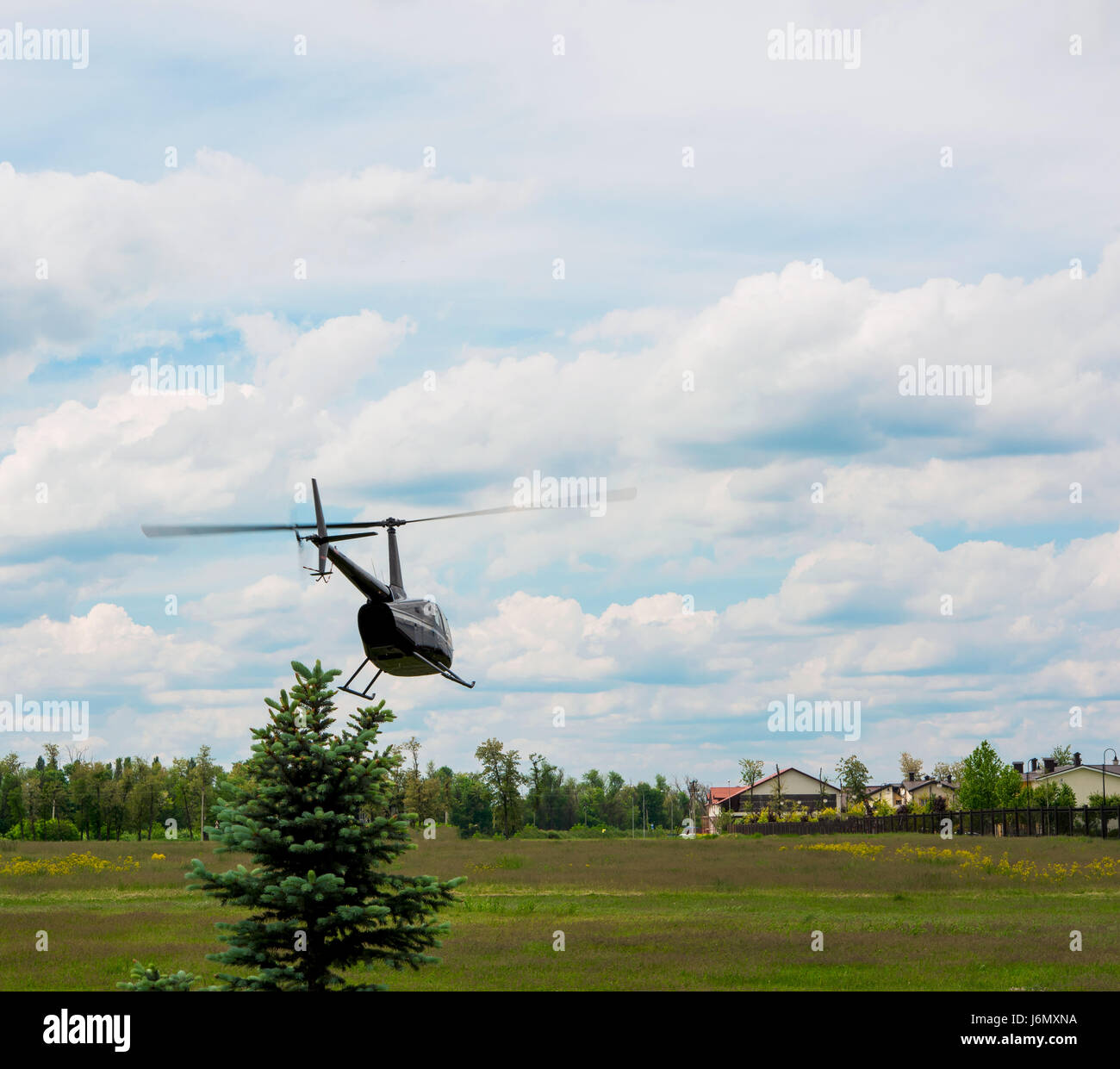 private helicopter fly over the green lawn Stock Photo - Alamy