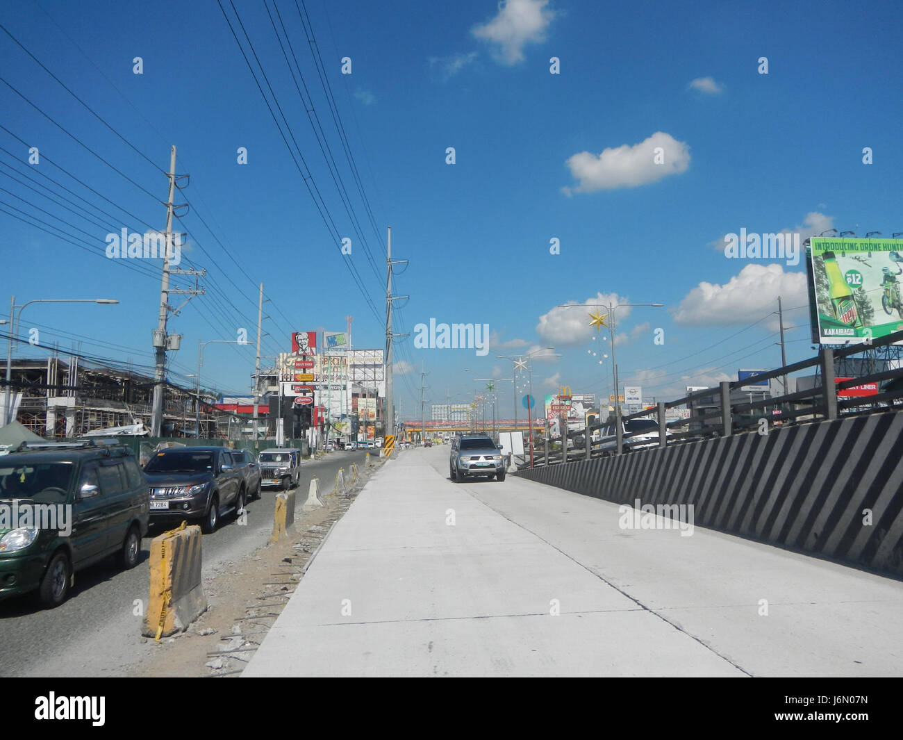 This image shows a section of the Olongapo-Gapan Road in Pampanga ...