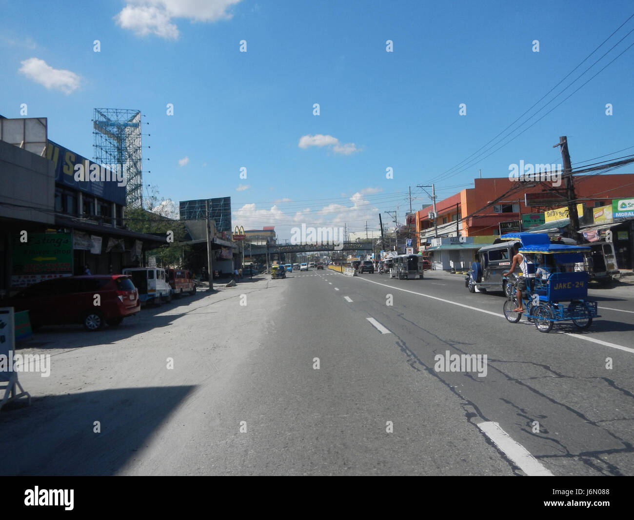The MacArthur Highway in San Fernando, Pampanga, is a key thoroughfare ...