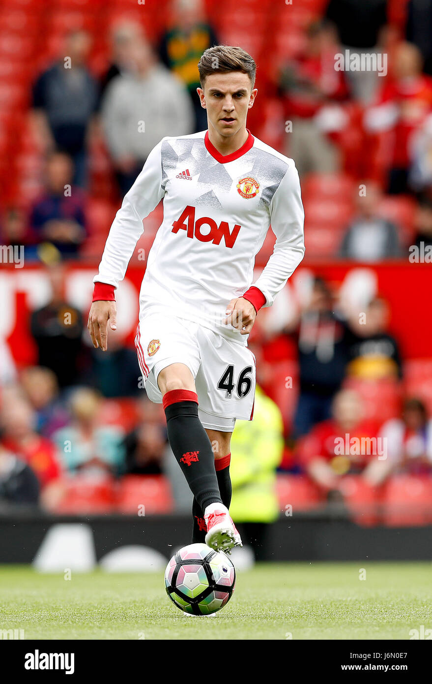 Manchester United's Josh Harrop warms-up before the Premier League ...